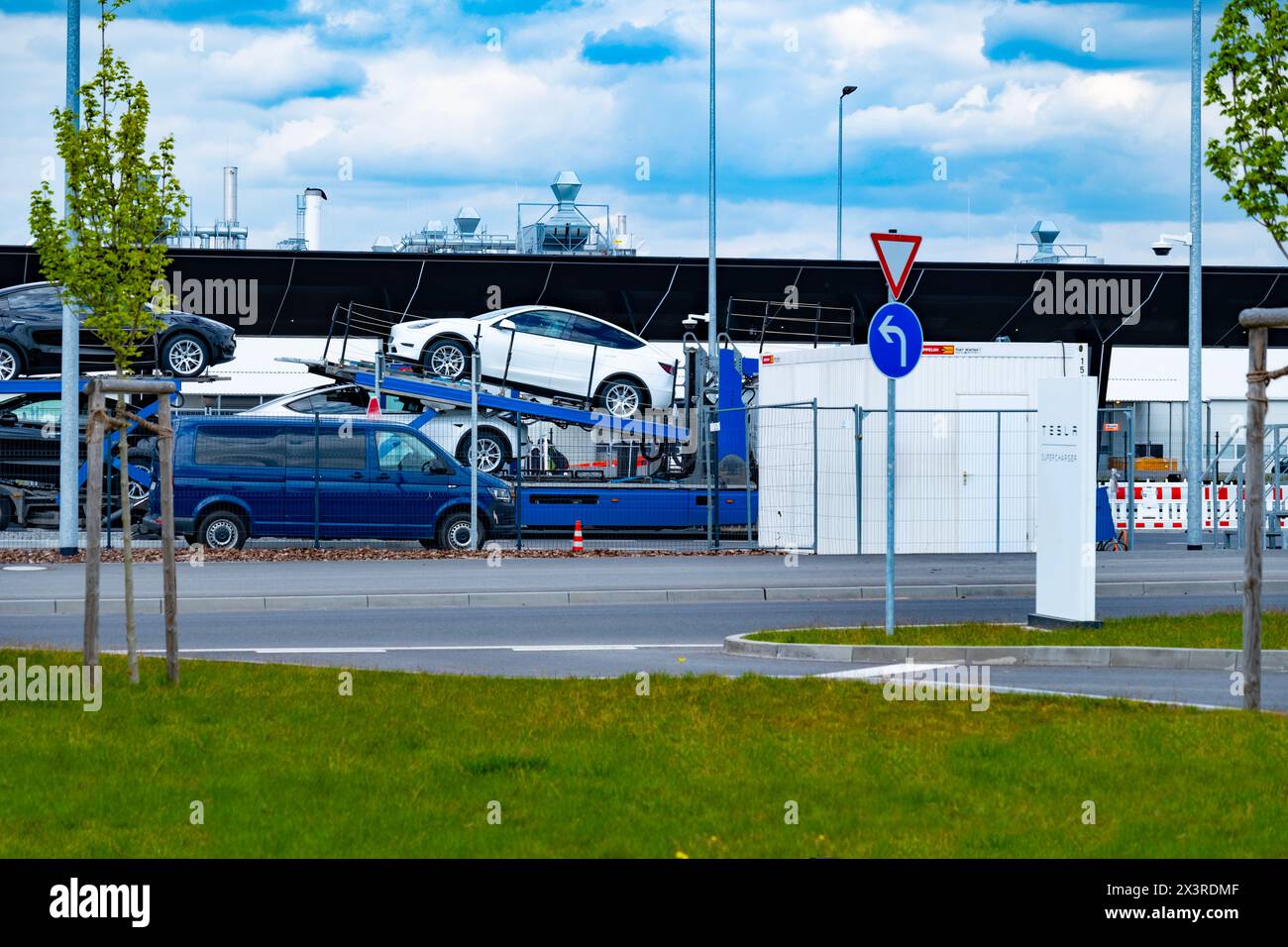 semi-truck transports loaded new Tesla vehicles leaving Gigafactory ...