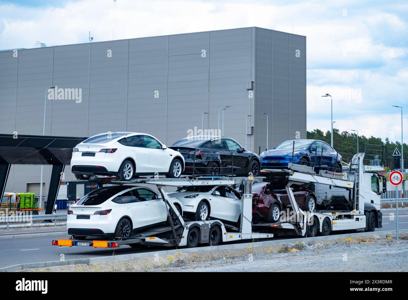 car transporter transports loaded new Tesla vehicles leaving ...