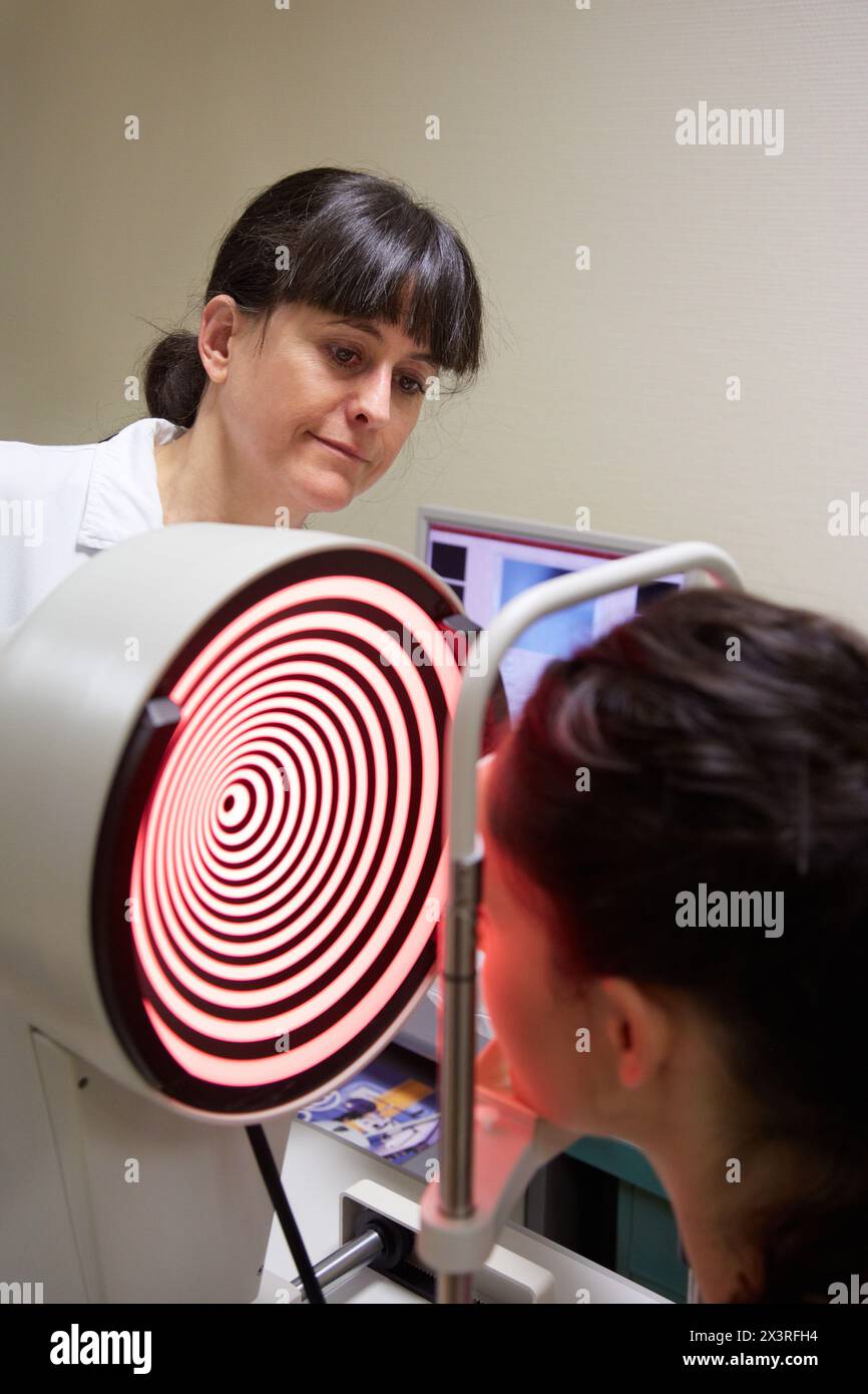 Eye examination Patient having a corneal topography measurement made of ...