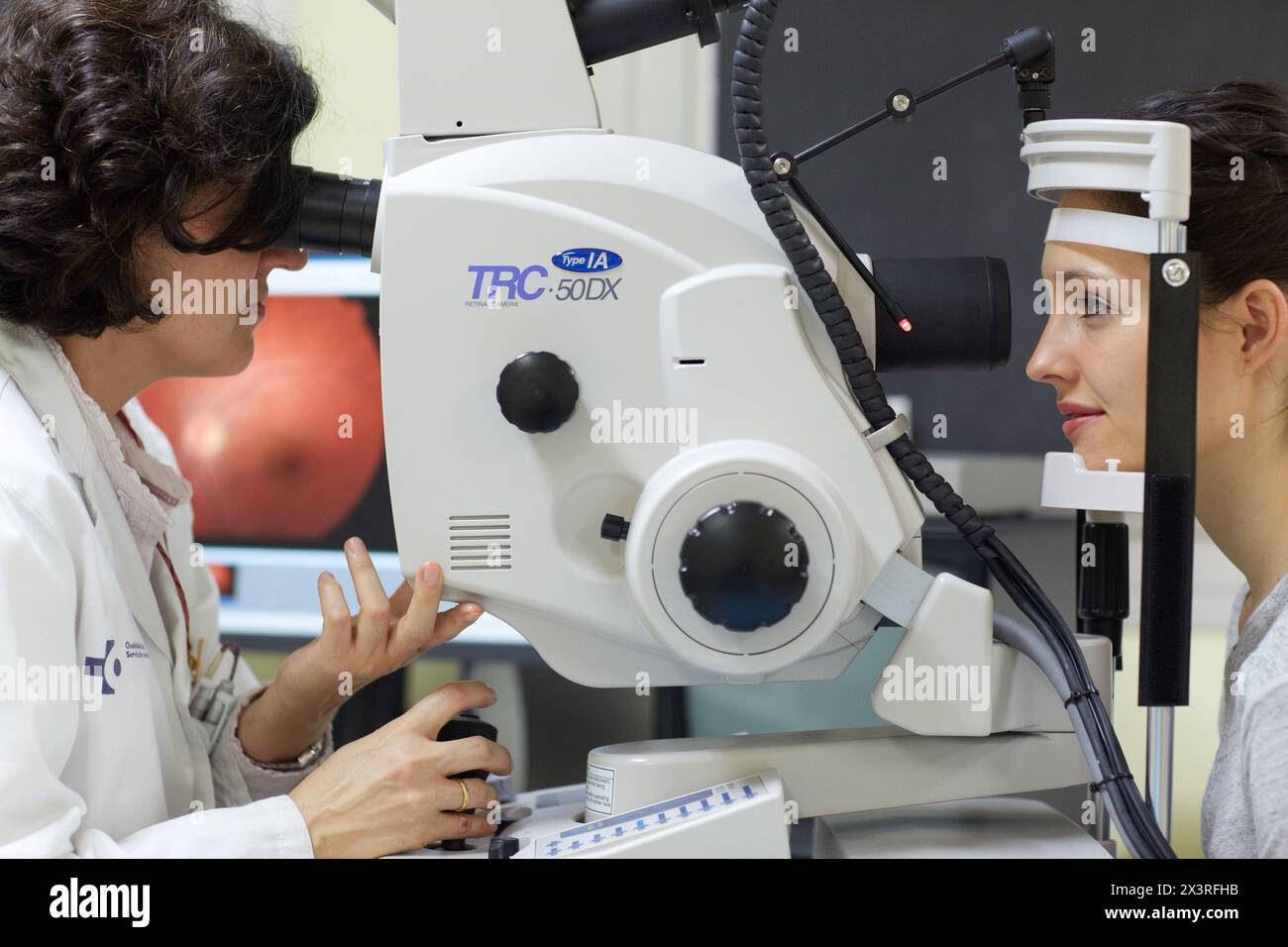 Eye examination Doctor using a retinal camera during an angiography ...