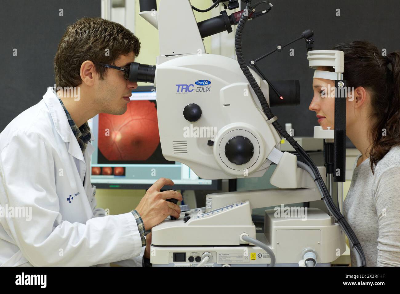 Eye examination Doctor using a retinal camera during an angiography ...
