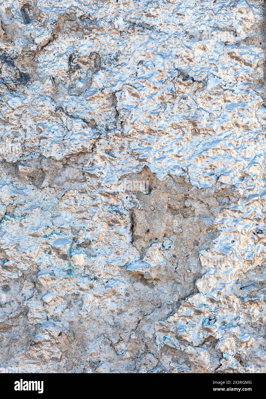 The crumbling plaster wall is painted with silver glitter paint have a ...