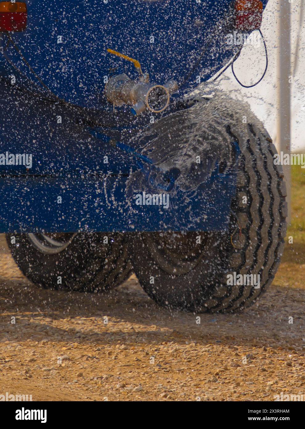 Water bowser, spreading water, spinning water, dampening down, dry ...