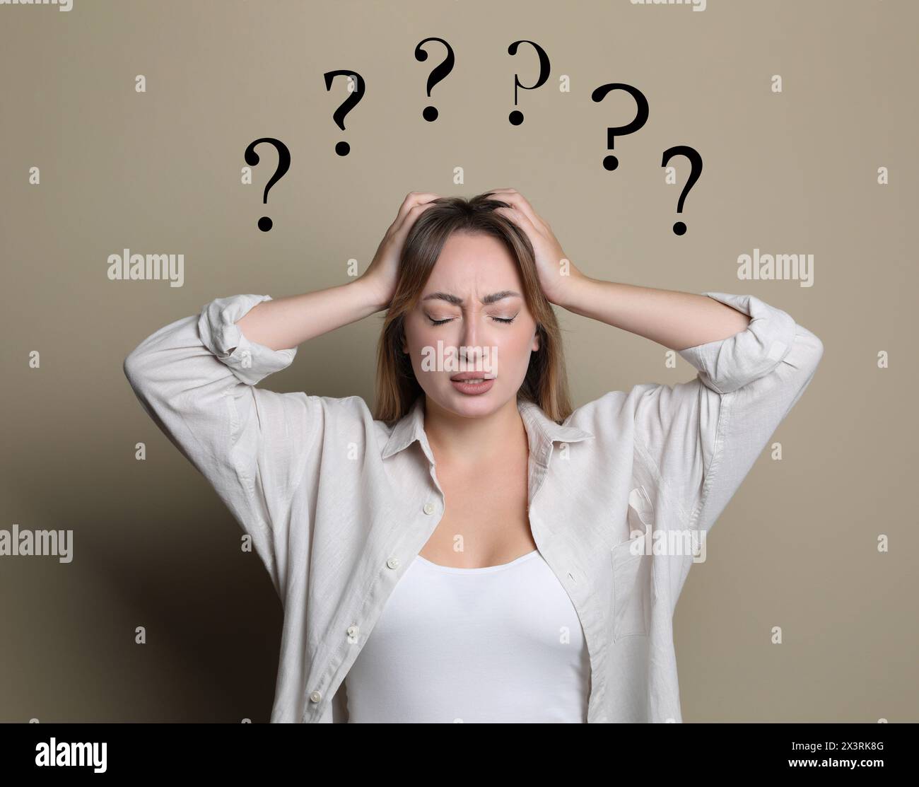 Amnesia Confused Young Woman And Question Marks On Beige Background