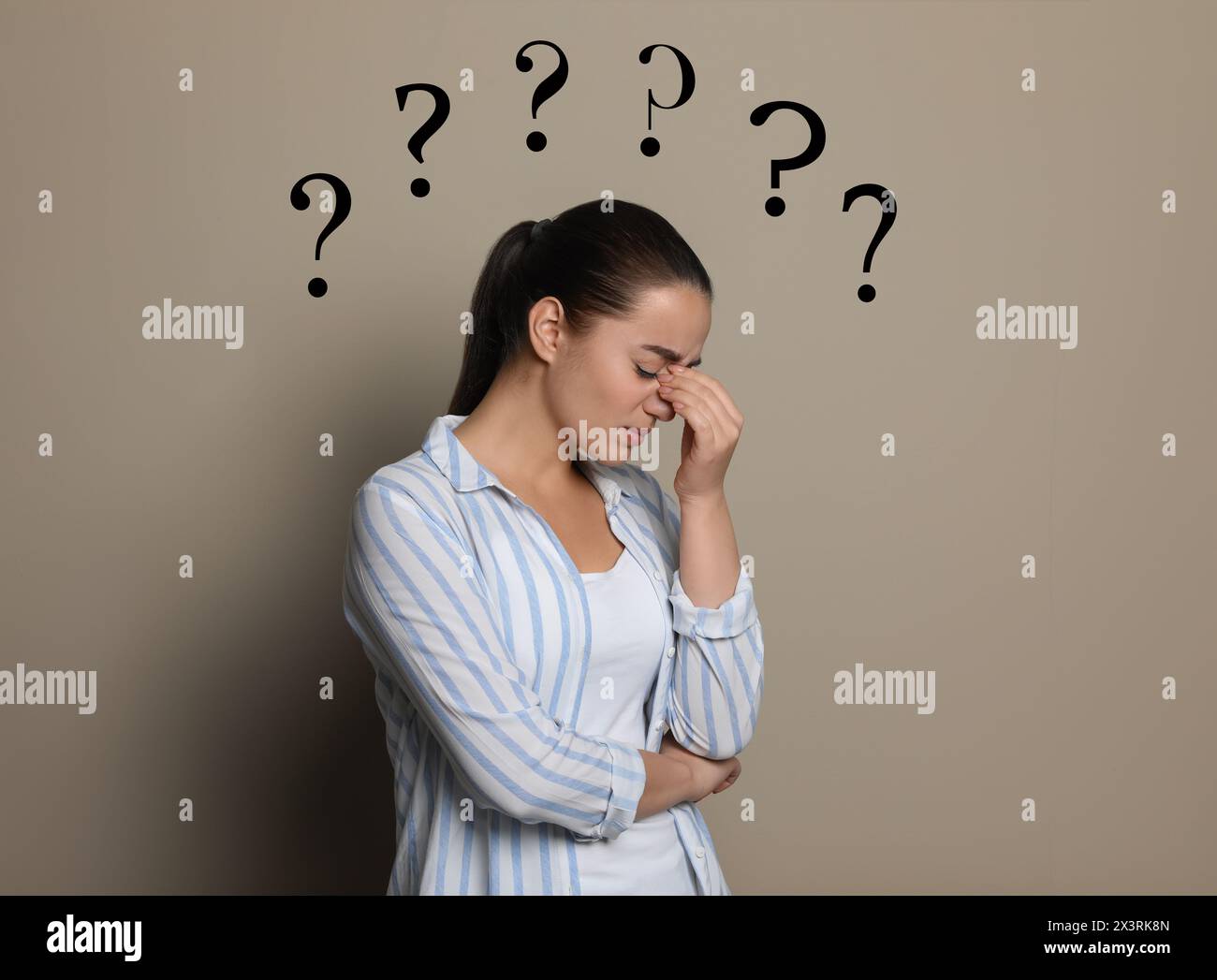 Amnesia Confused Young Woman And Question Marks On Beige Background