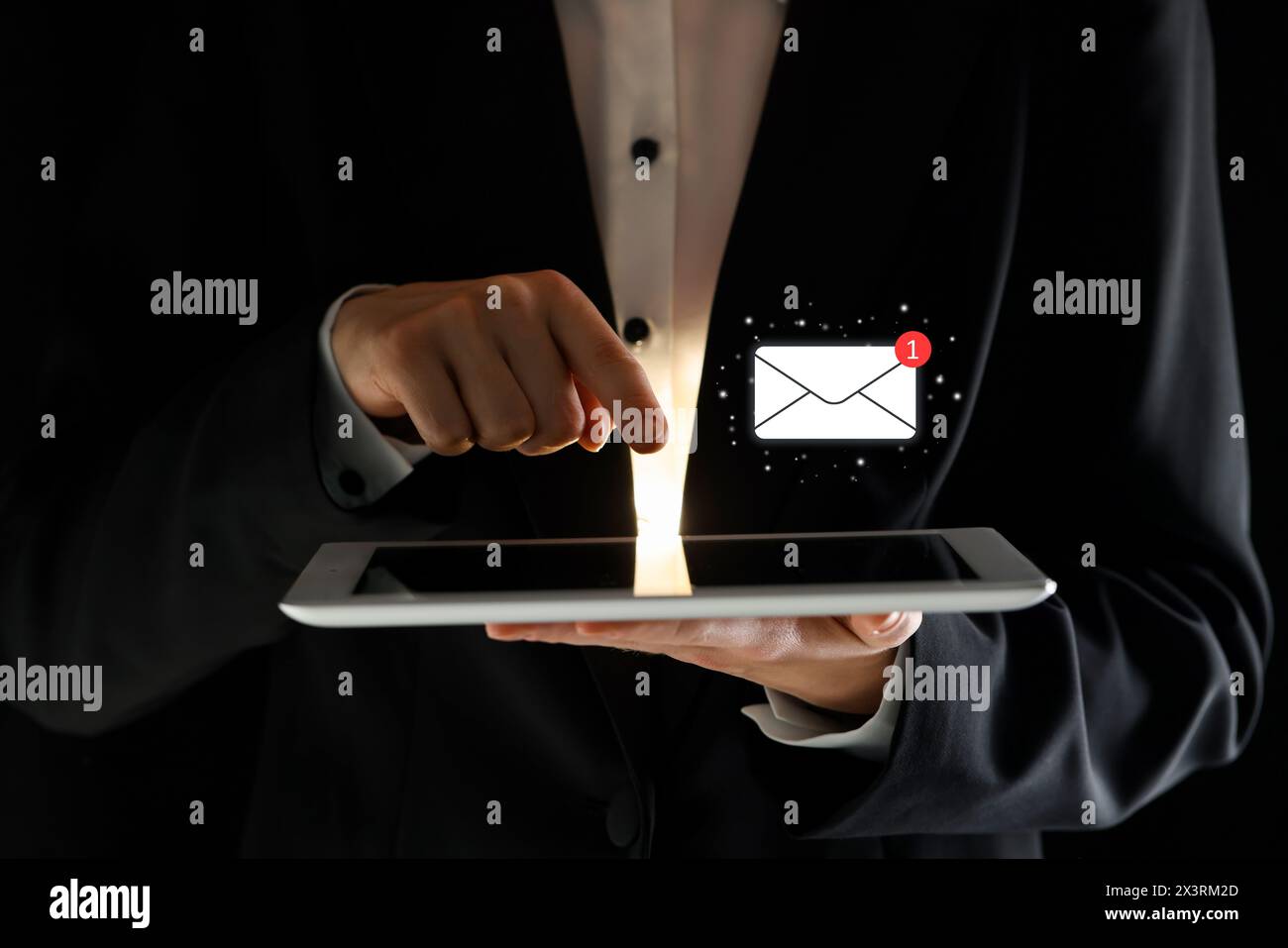Email. Man using tablet against black background, closeup. Incoming ...