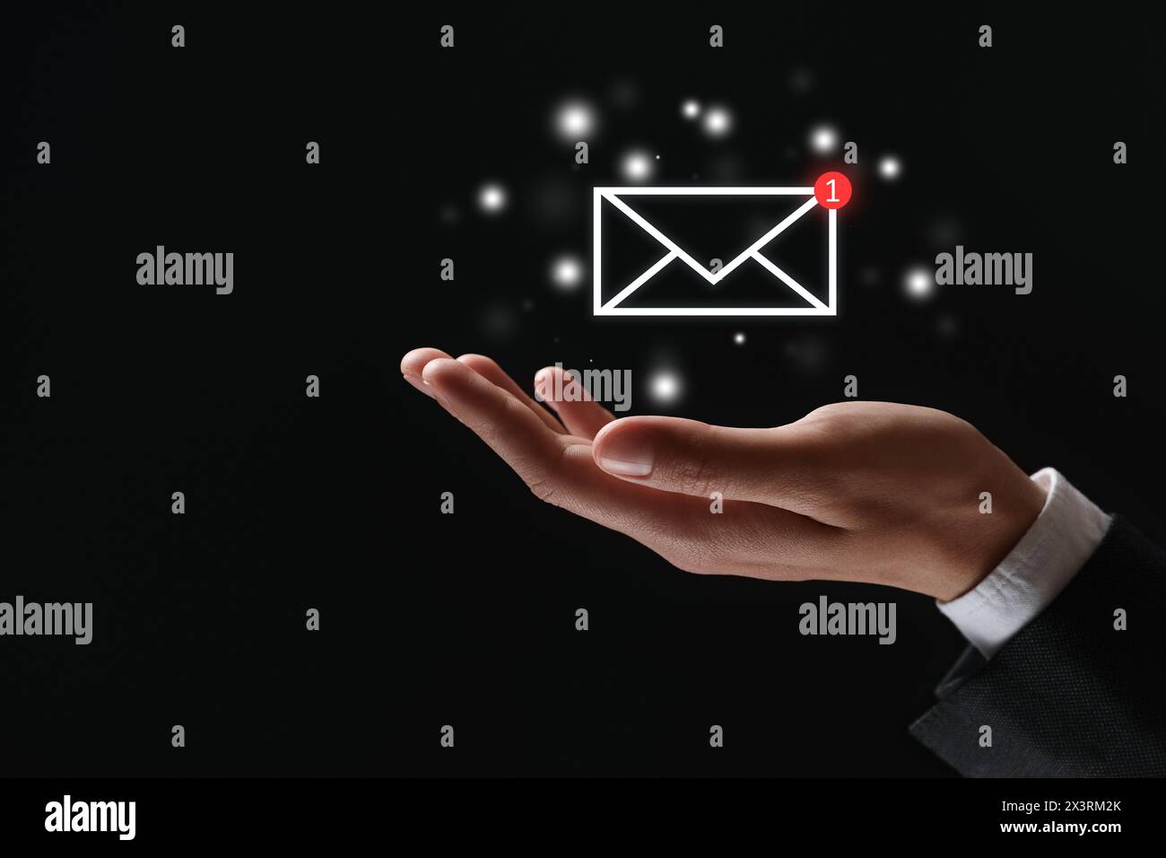 Incoming email. Man holding virtual envelope against black background ...