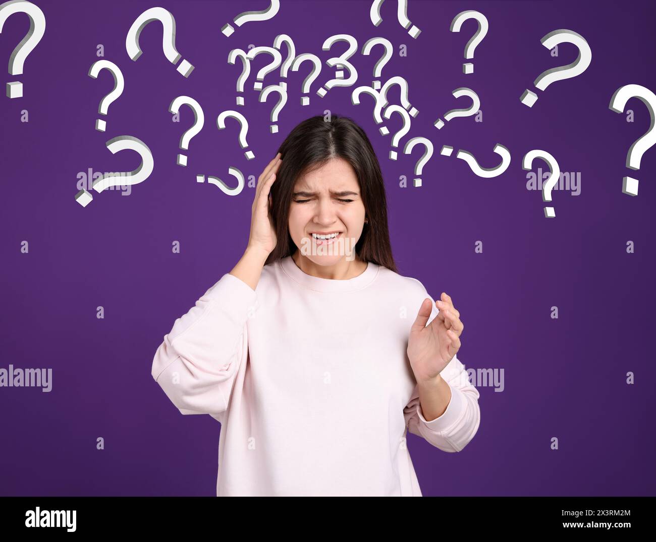 Amnesia. Confused young woman and question marks on purple background ...