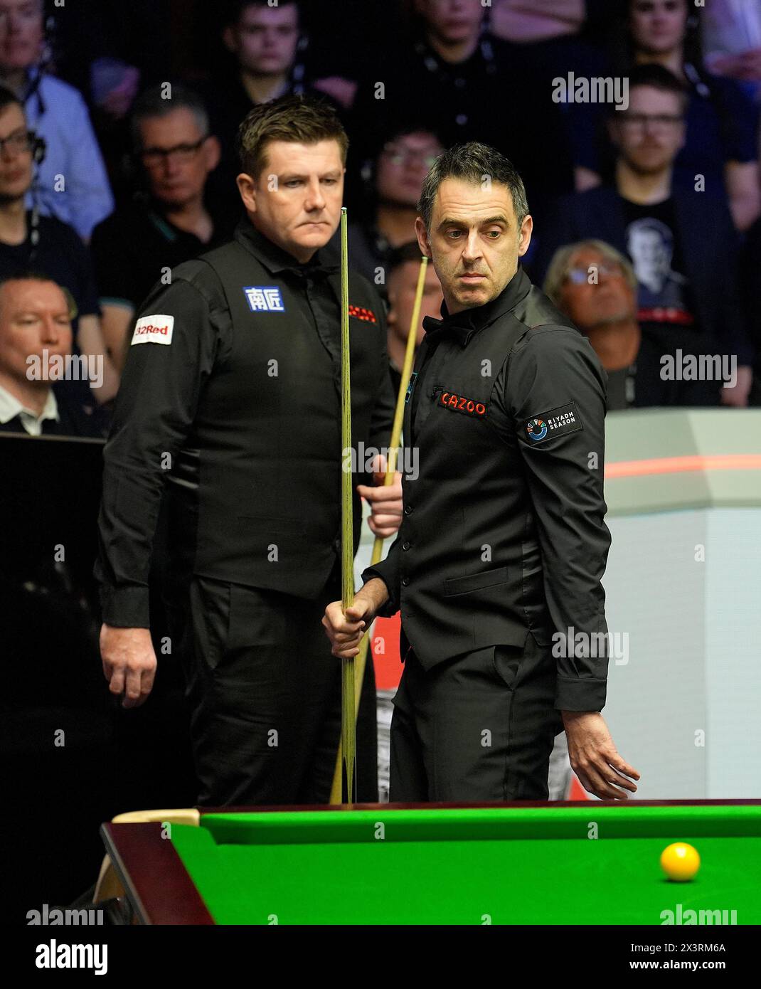 Ryan Day (left) and Ronnie O'Sullivan look at the table during their ...