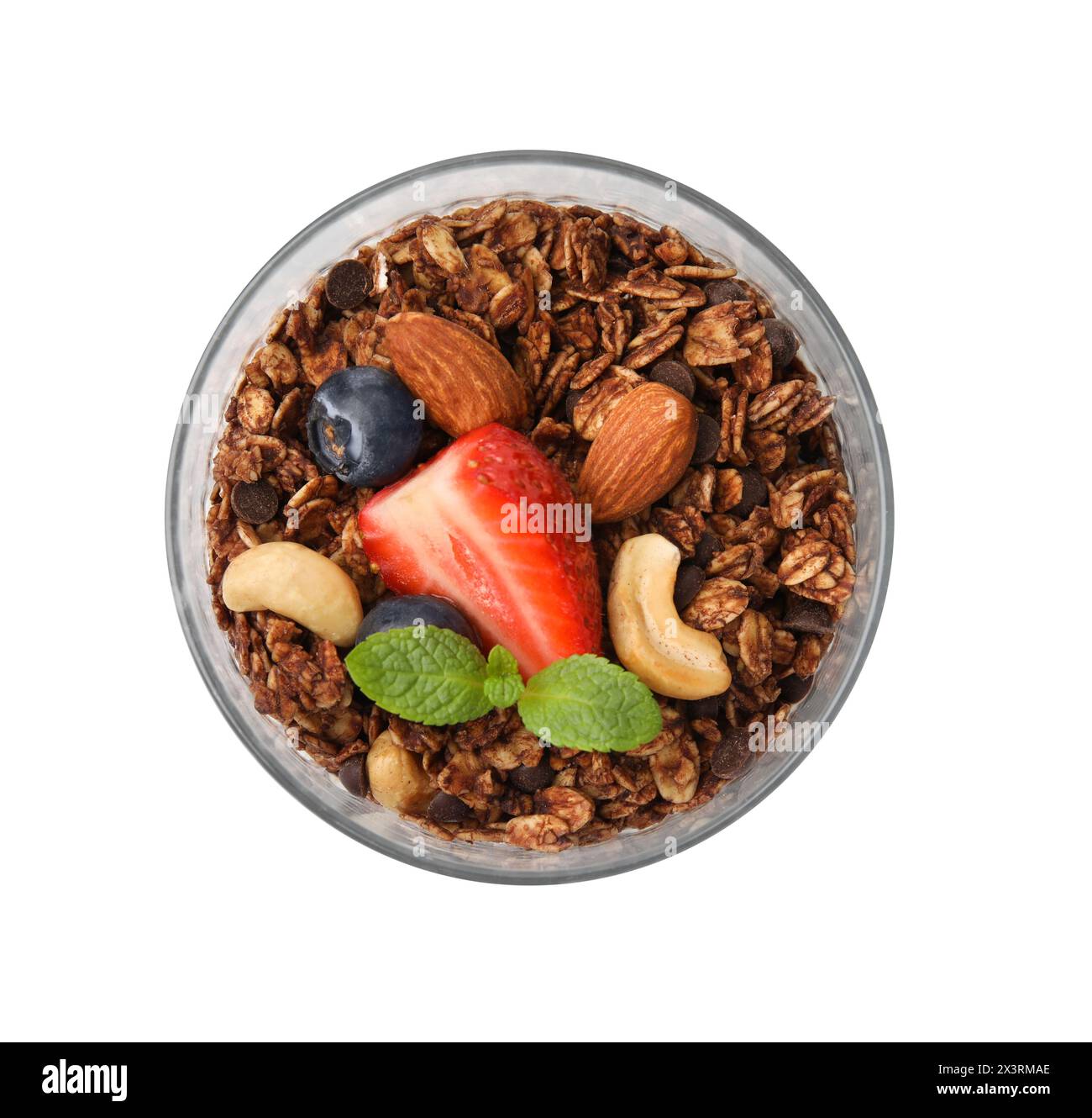 Tasty granola with berries and nuts in glass isolated on white, top ...