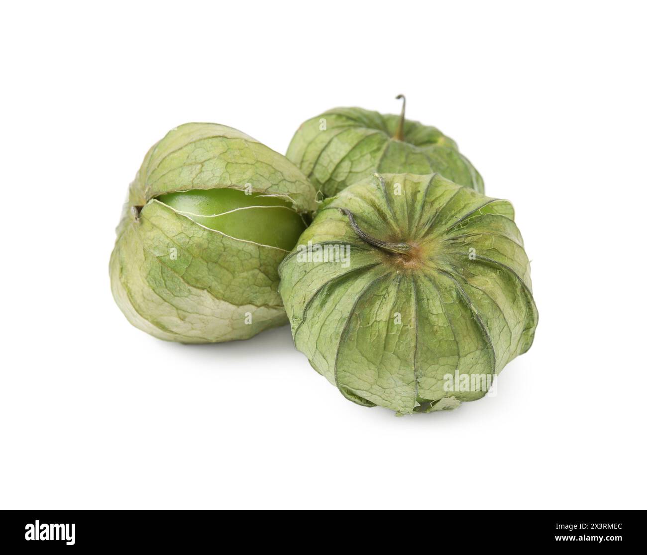Fresh green tomatillos with husk isolated on white Stock Photo - Alamy