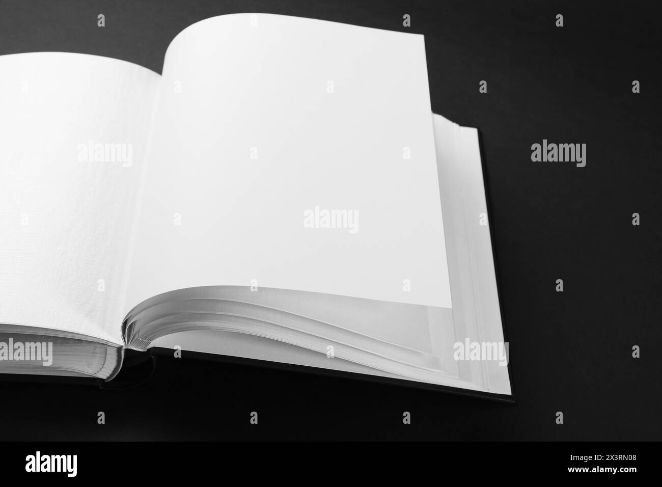 One open photo album on black background, closeup. Space for text Stock ...