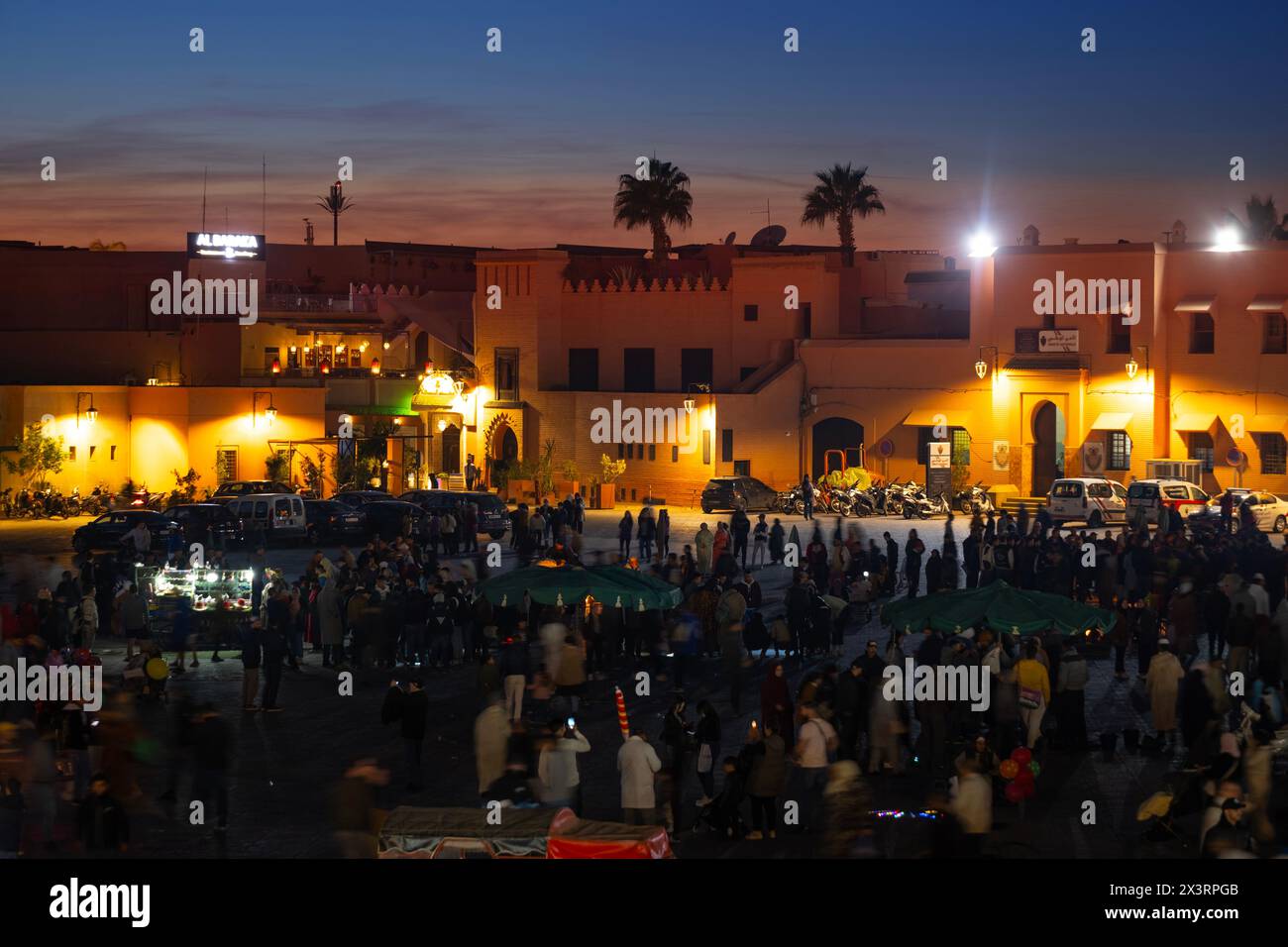 crowds of tourists on ancient streets Marrakech at night, Jamaa el Fna ...