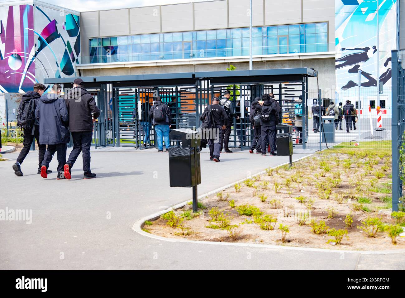 crowd workers men, people going to work shift at Tesla Gigafactory ...