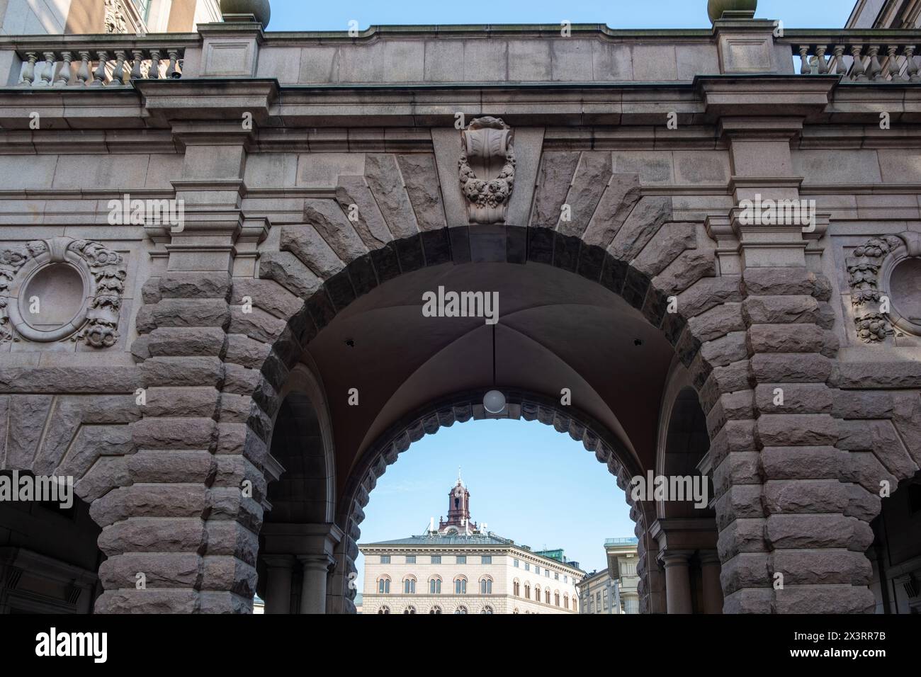 View of The Great Church Storkyrkan Clock Tower from arched gate of ...