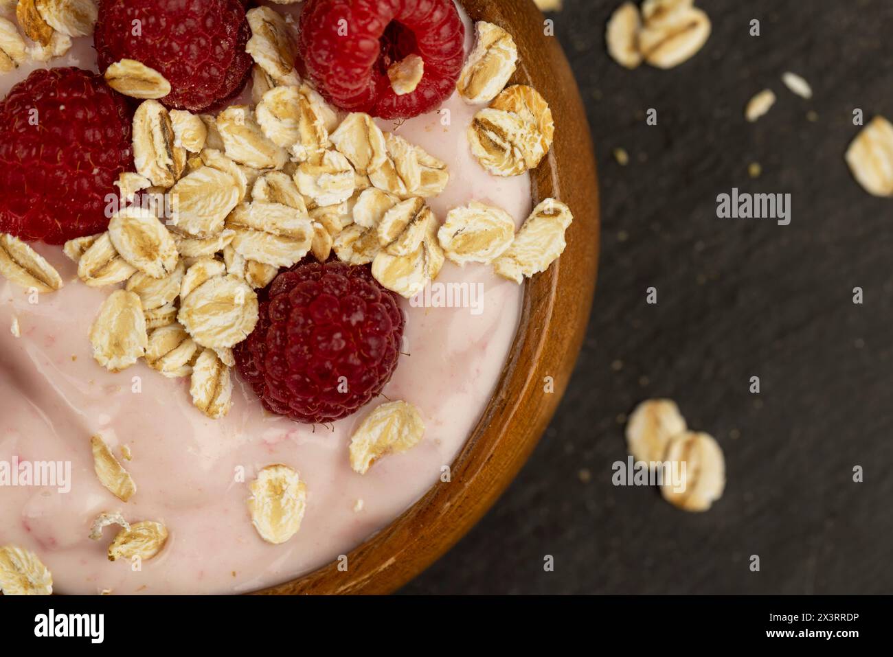 fresh yogurt with raspberry flavor and oat flakes , milk yogurt with ...