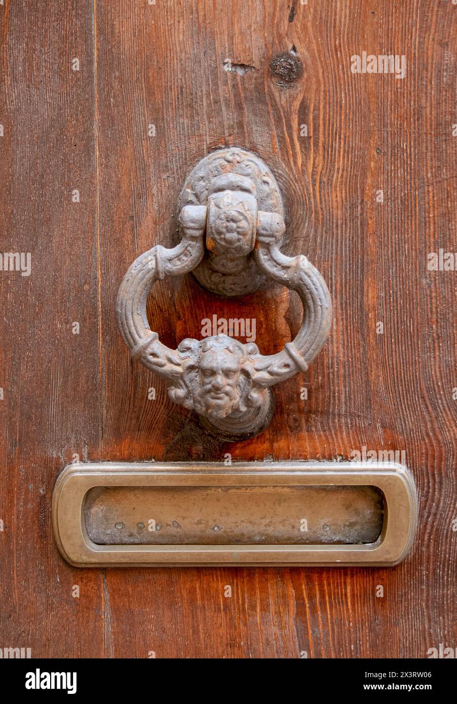 Antique details on an old wooden door. Medieval door handle Stock Photo ...