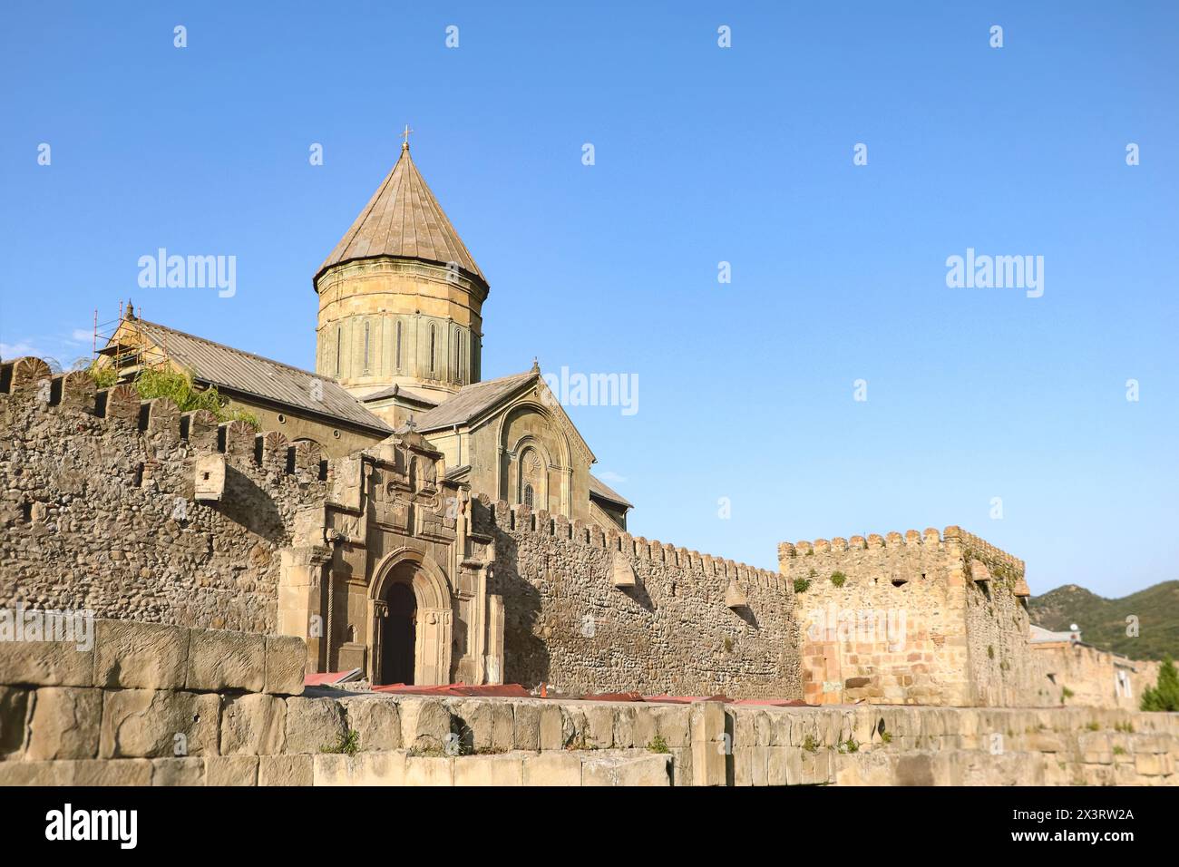 Old Georgian stone church. Landscape with a church Stock Photo - Alamy