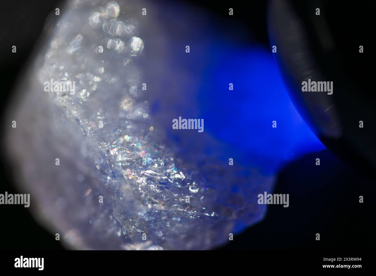 quartz closeup with with violet light Stock Photo - Alamy