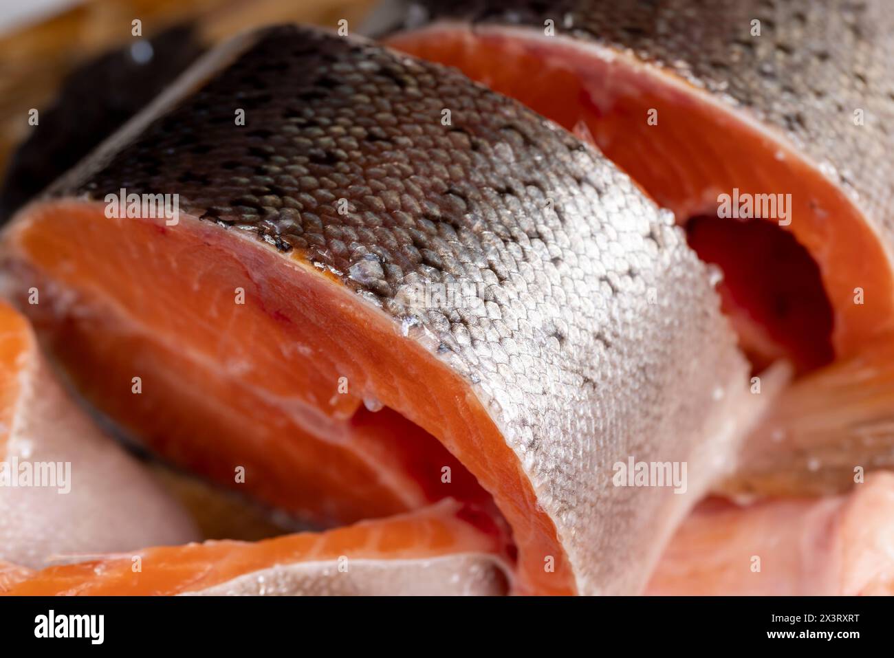 red trout meat in the kitchen, cooking a fish dish with expensive red ...