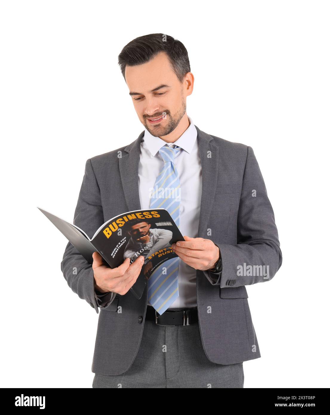 Handsome businessman in suit reading magazine on white background Stock ...