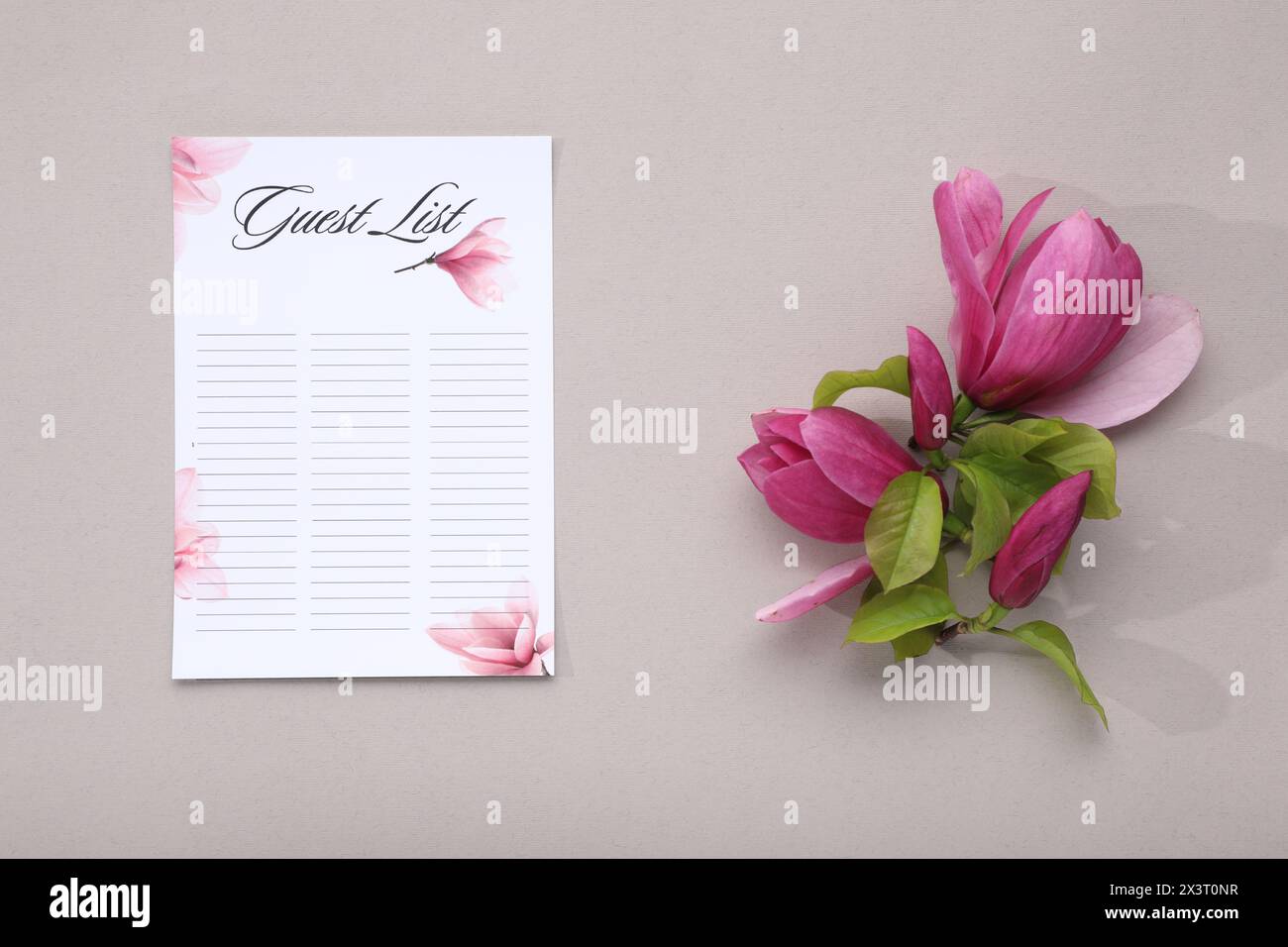 Guest list and beautiful flowers on grey background, flat lay. Space ...