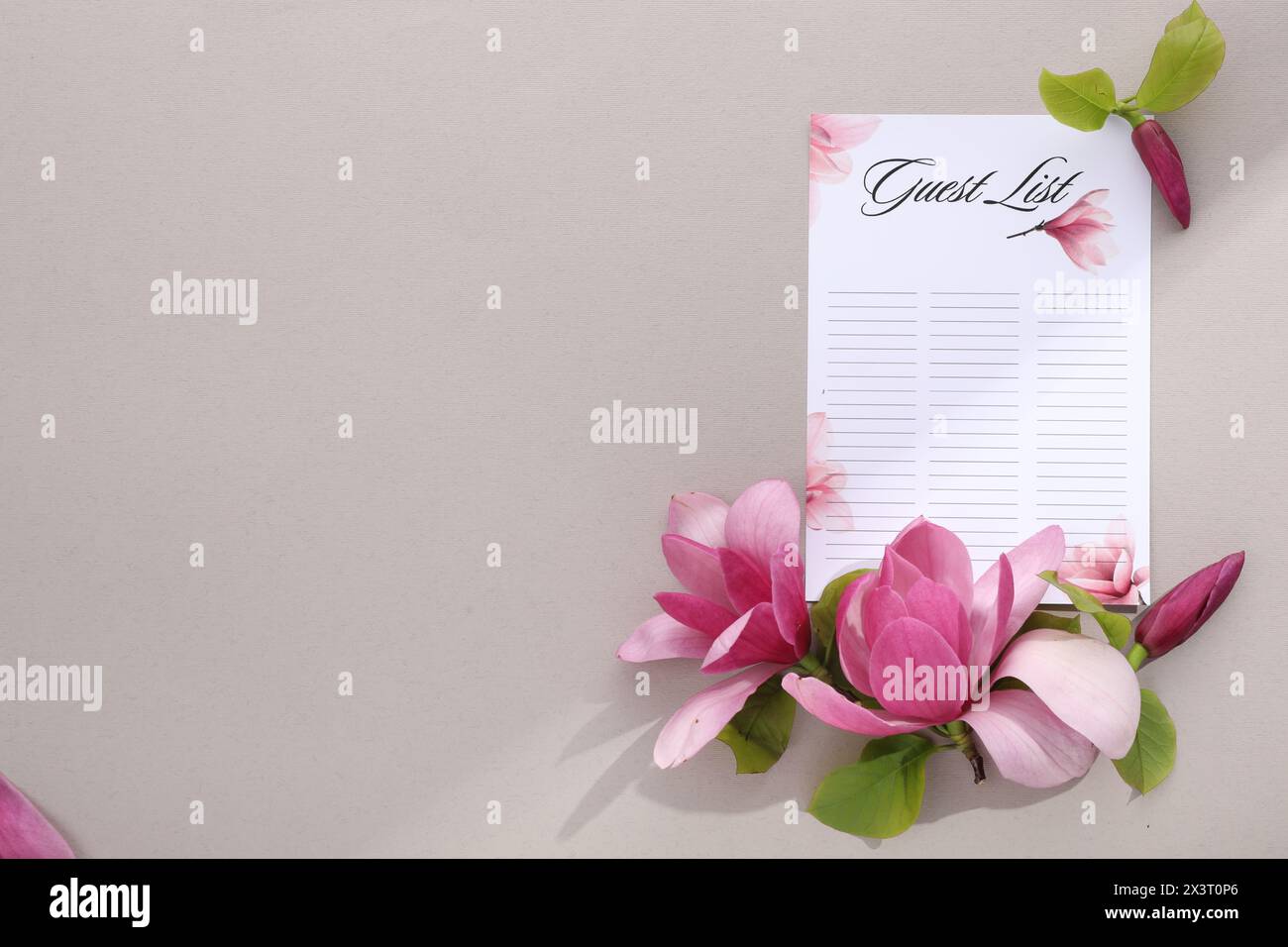 Guest list and beautiful flowers on grey background, flat lay. Space ...