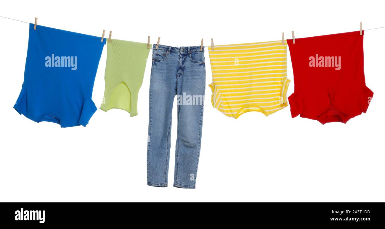 Different clothes drying on laundry line against white background Stock ...