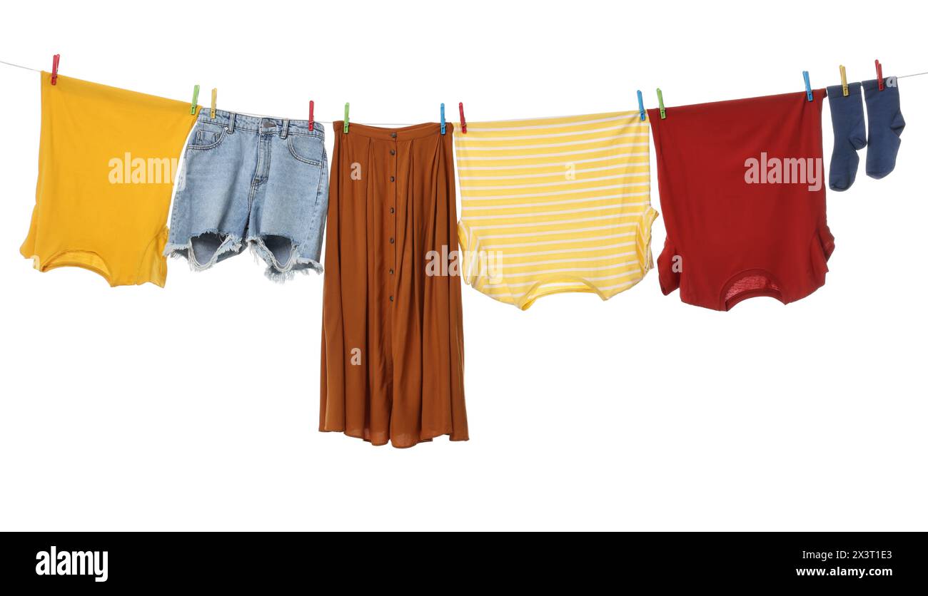 Different clothes drying on laundry line against white background Stock ...