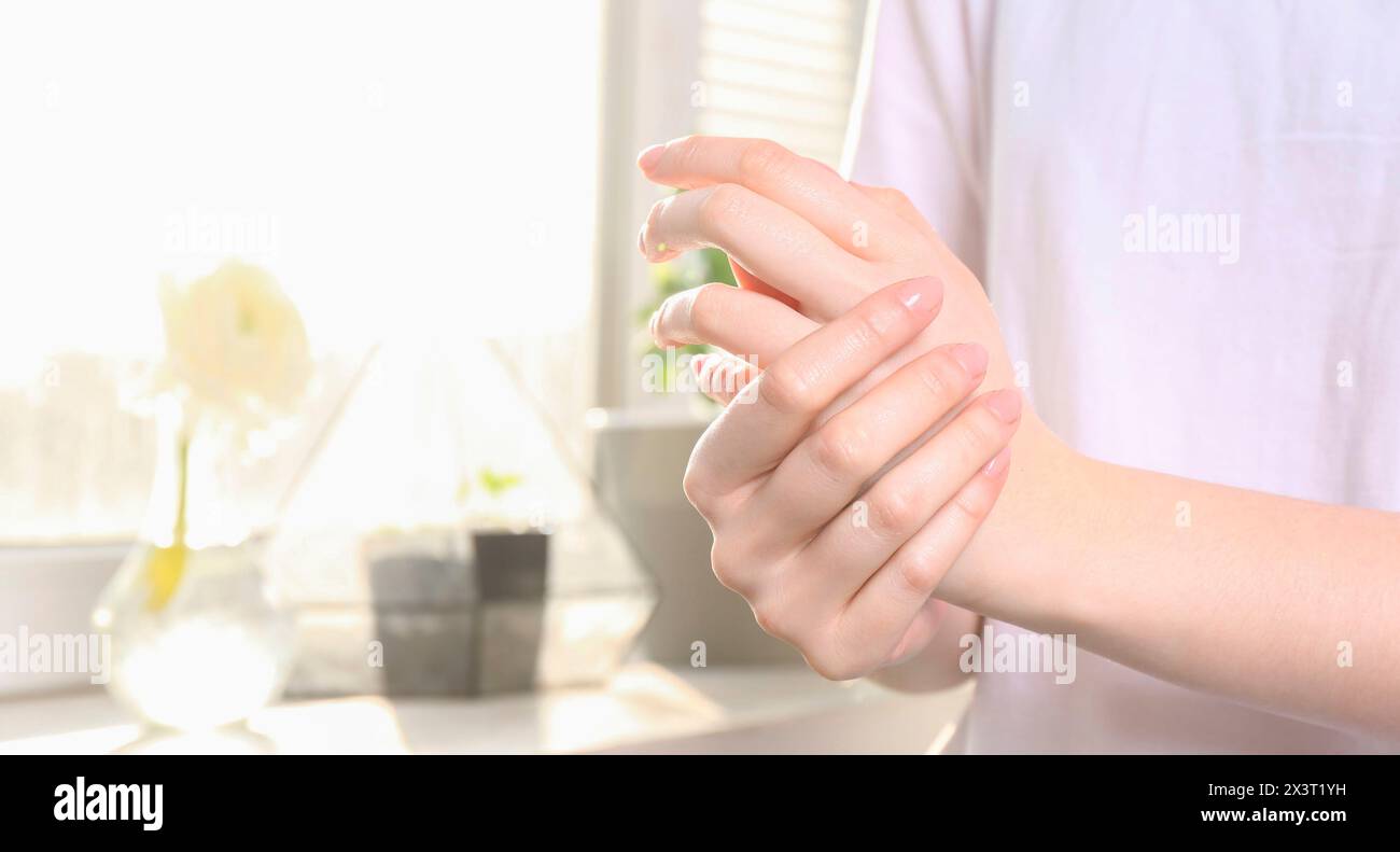 Woman applying nourishing body cream hi-res stock photography and ...
