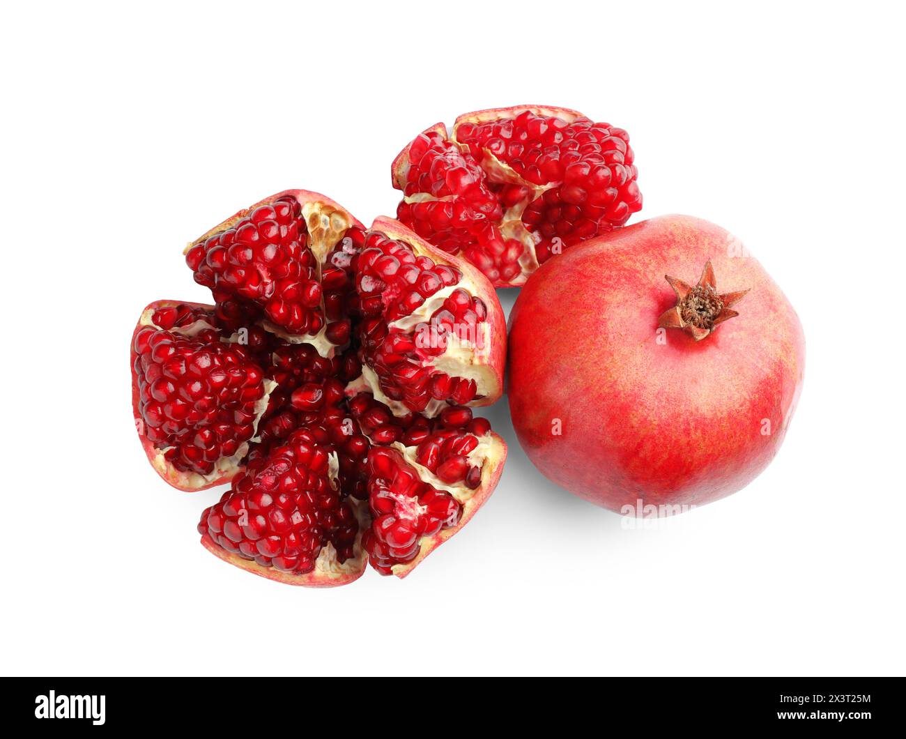 Whole and cut fresh pomegranates isolated on white, top view Stock ...
