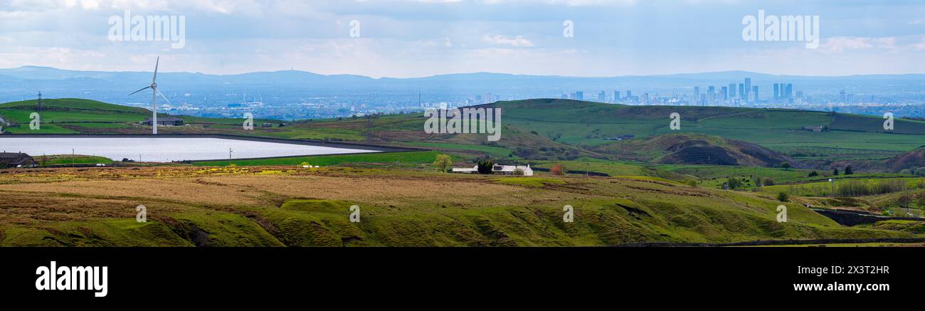 Countryside landscape image of a reservoir, wind turbine and Manchester ...