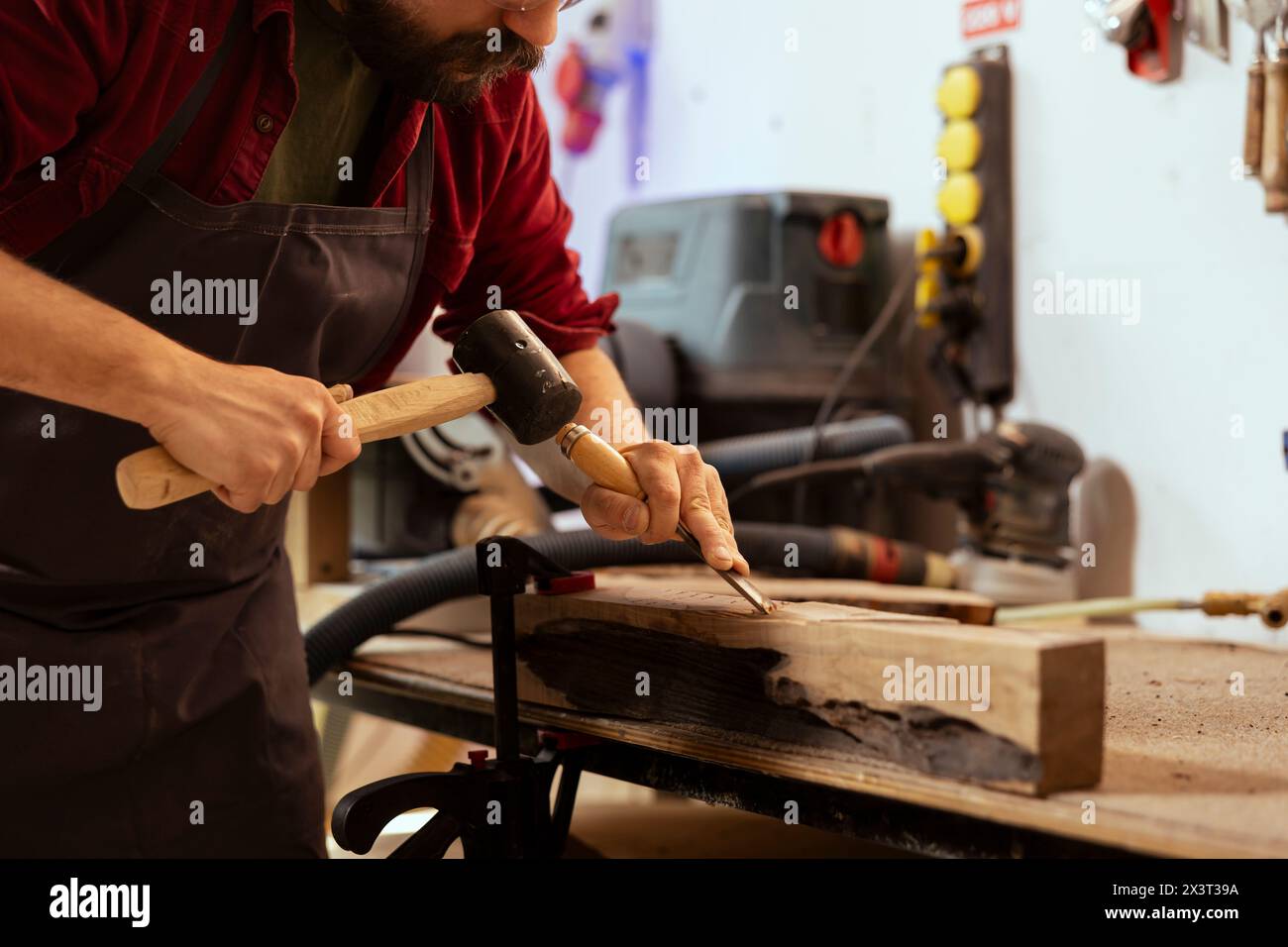 Skilled carpenter meticulously carving intricate designs into wood ...