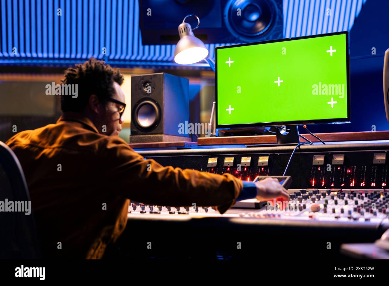 African american producer editing music on console with isolated ...
