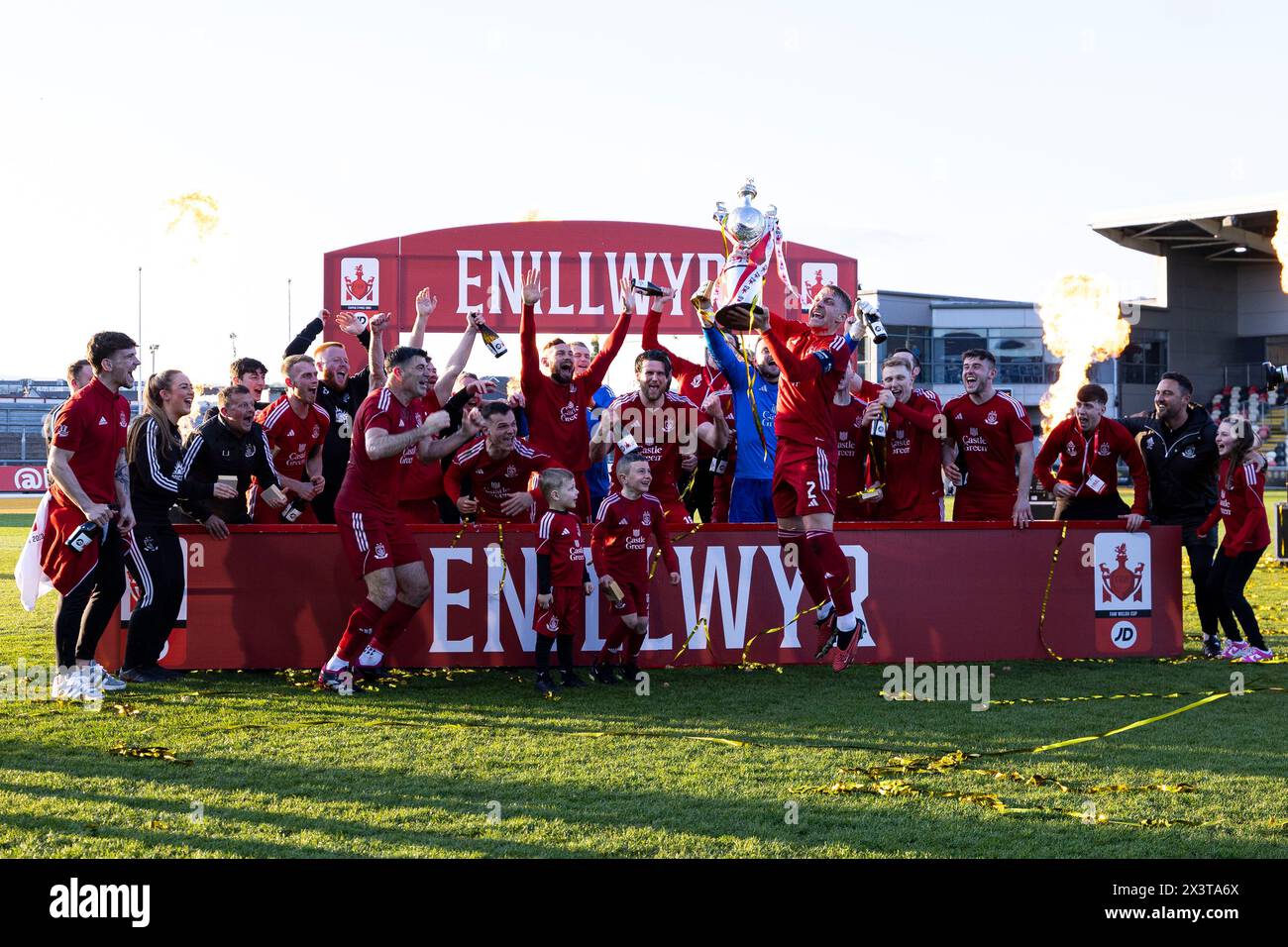 Newport, UK. 28th Apr, 2024. John Disney of Connahs Quay lifts the cup ...
