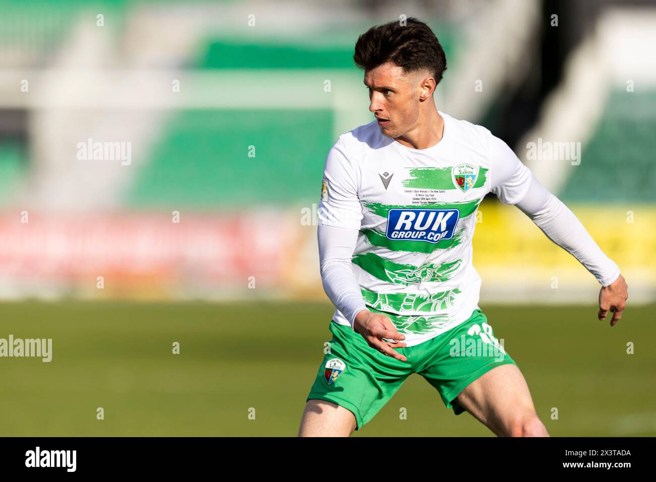 Newport, UK. 28th Apr, 2024. Daniel Redmond of TNS in action. Connahs ...