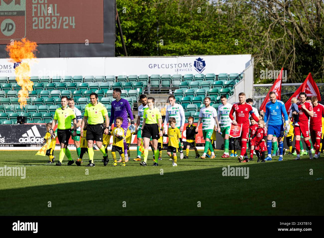 Newport, UK. 28th Apr, 2024. Referee Bryn Markham-Jones leads the sides ...