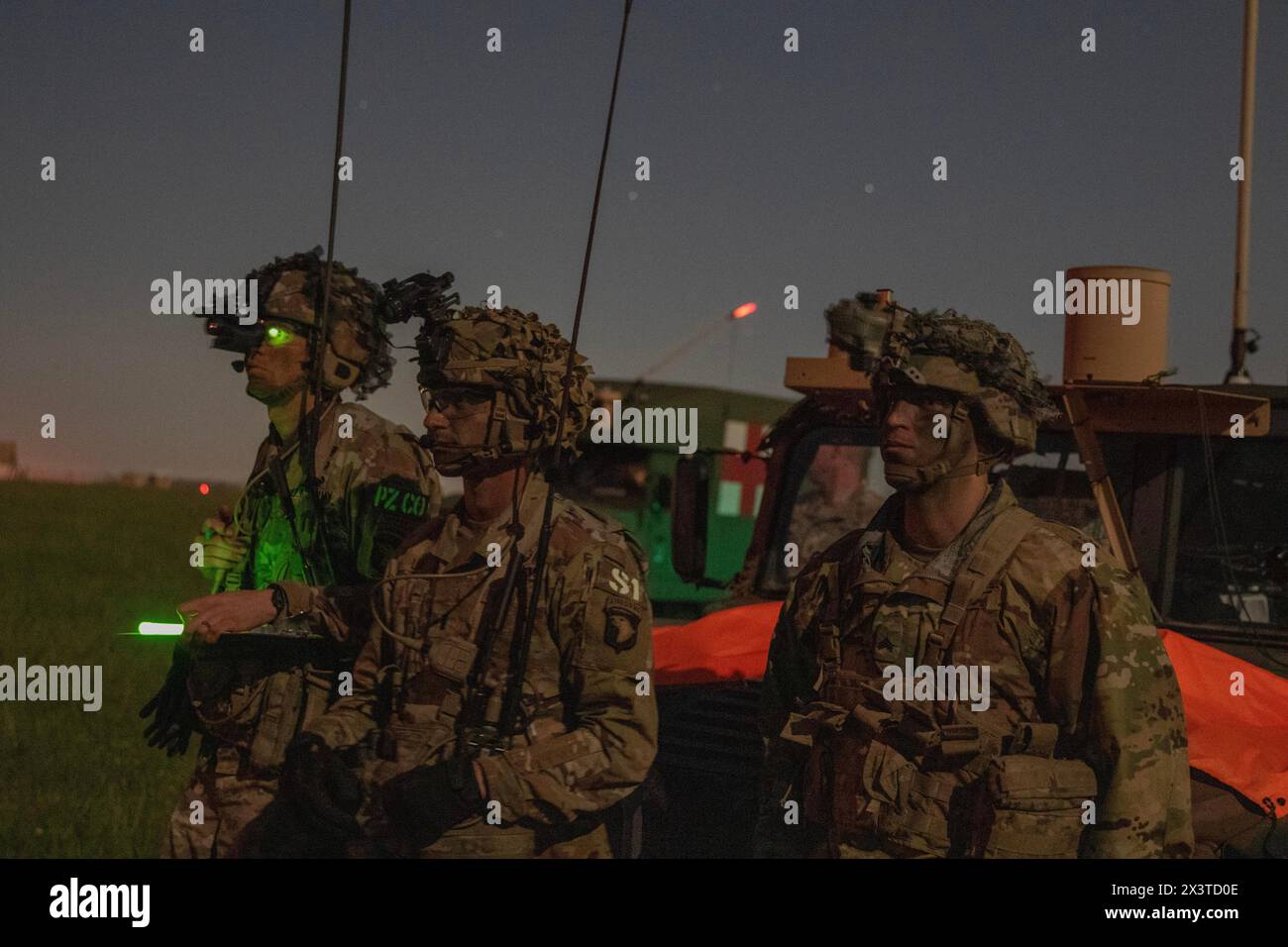 Soldiers from the 101st Airborne Division (Air Assault) observe the ...