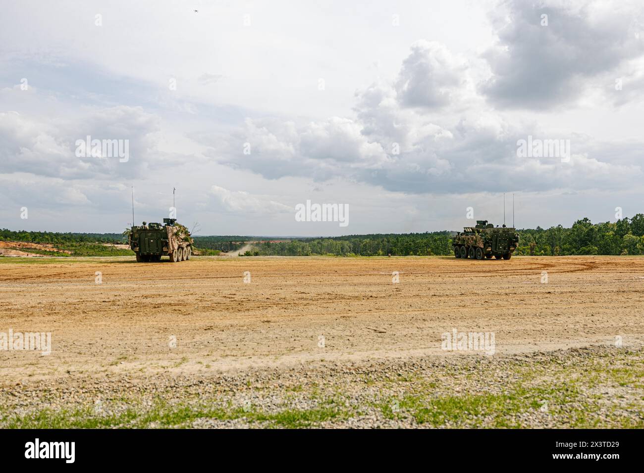 Two Bradley Fighting Vehicles move into firing position on Red Cloud ...