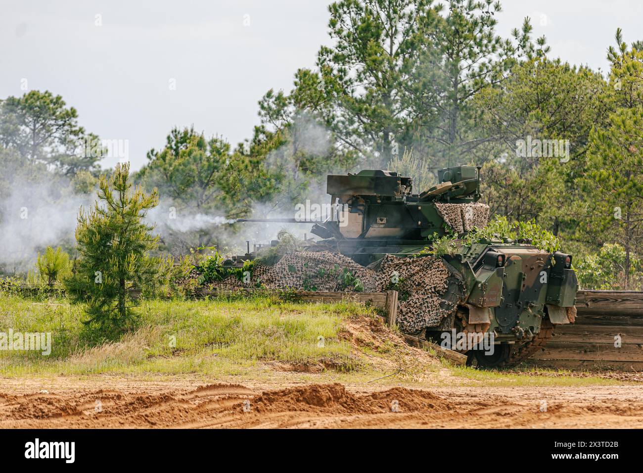 A Bradley Fighting Vehicle fires at a simulated enemy target on Red ...