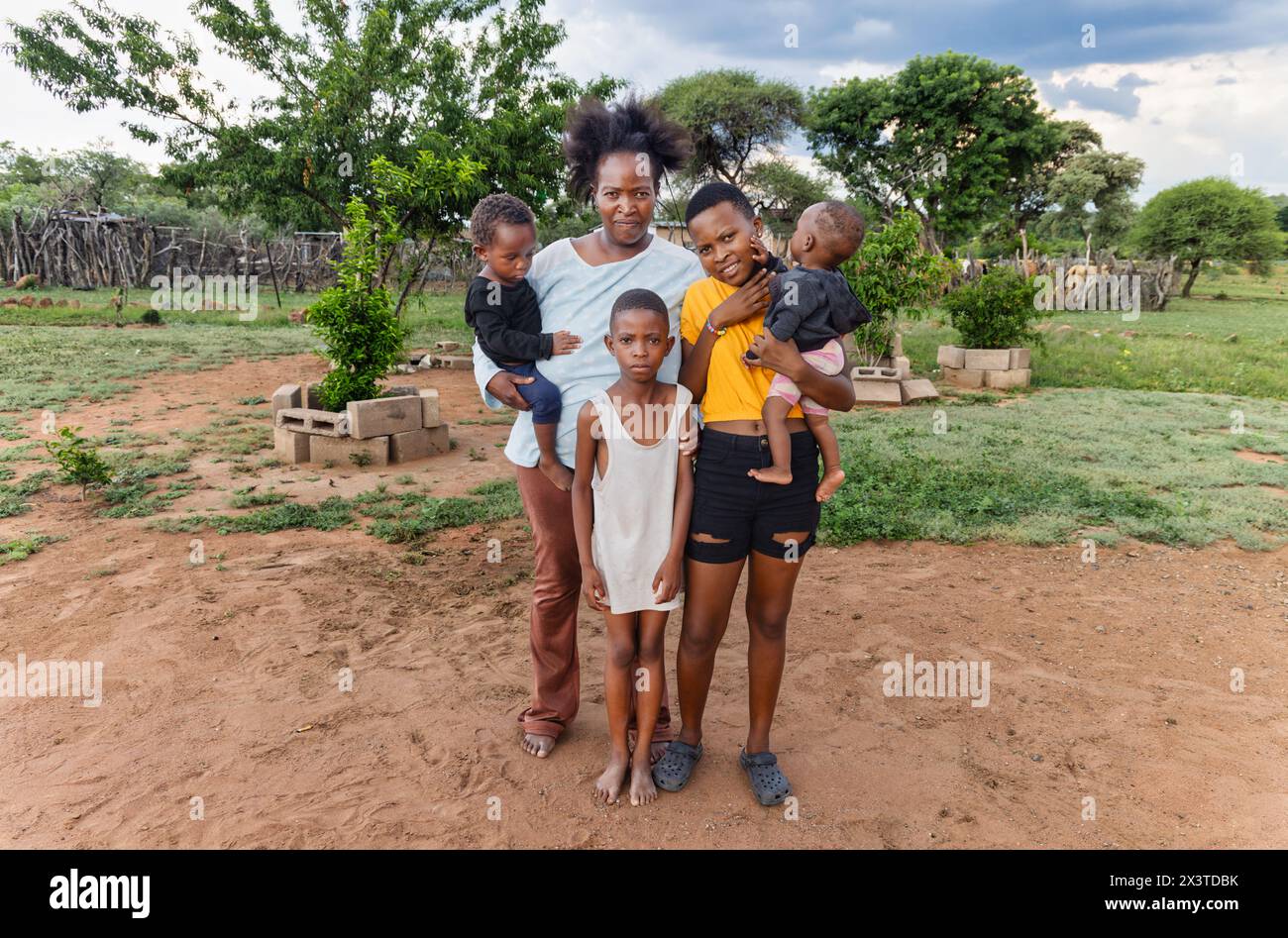 african village , large african family mother with few children ...