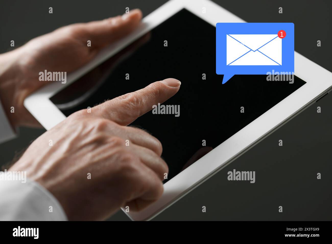 Email. Man using tablet against dark background, closeup. Incoming ...