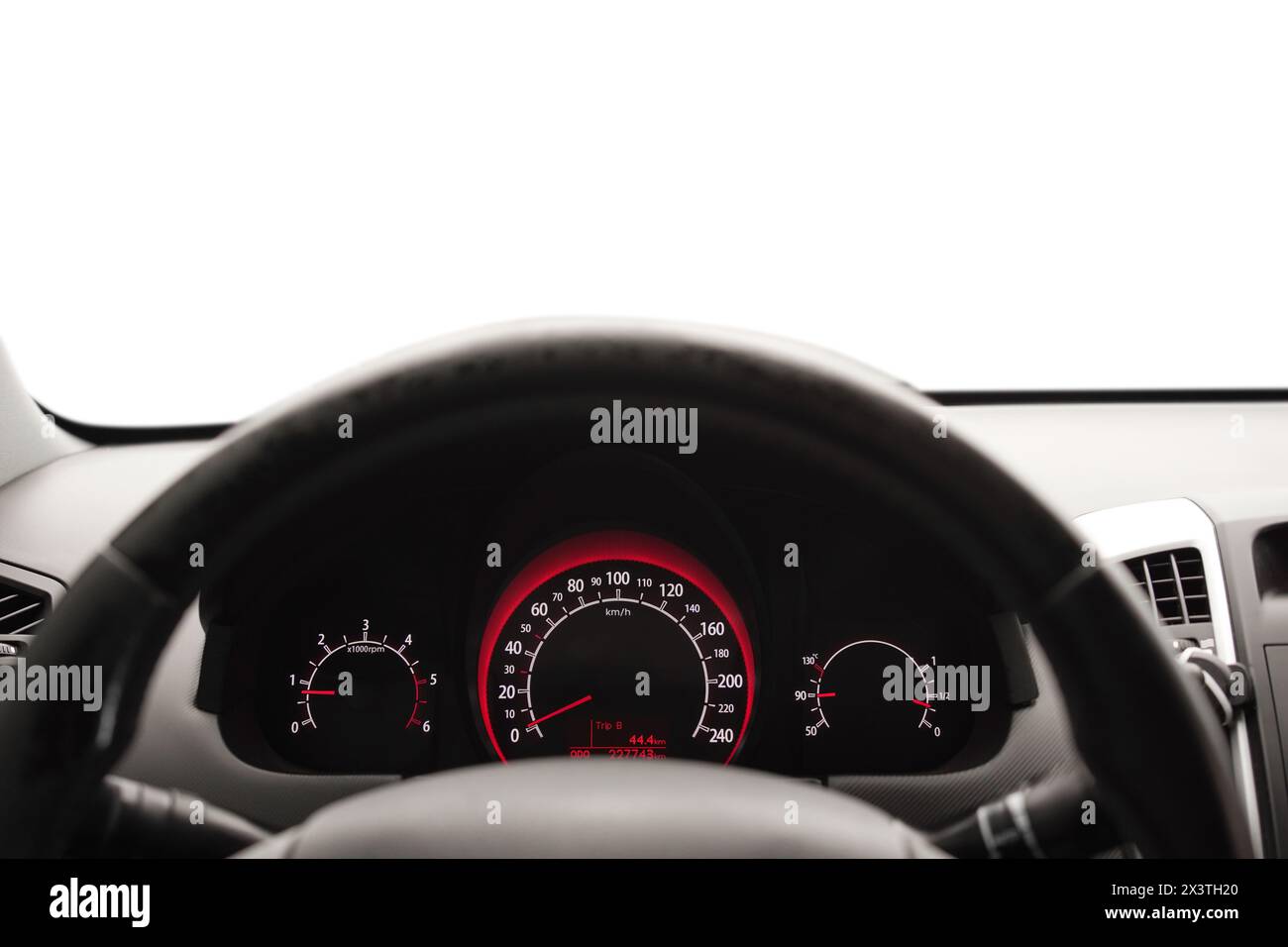Speedometer on dashboard and steering wheel inside car Stock Photo - Alamy