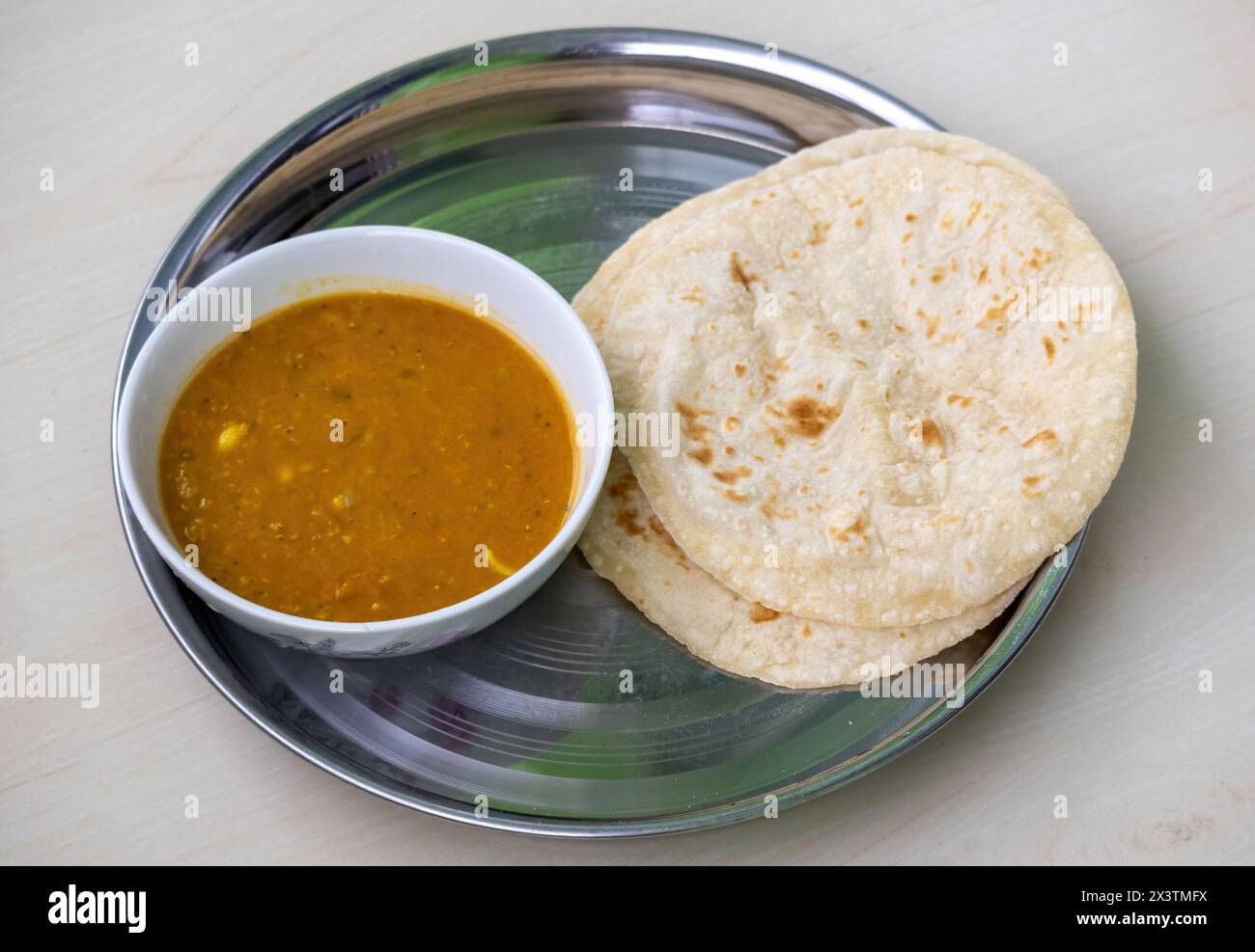 Bengali's most popular meal Dal and Roti in a dish. Traditional food ...