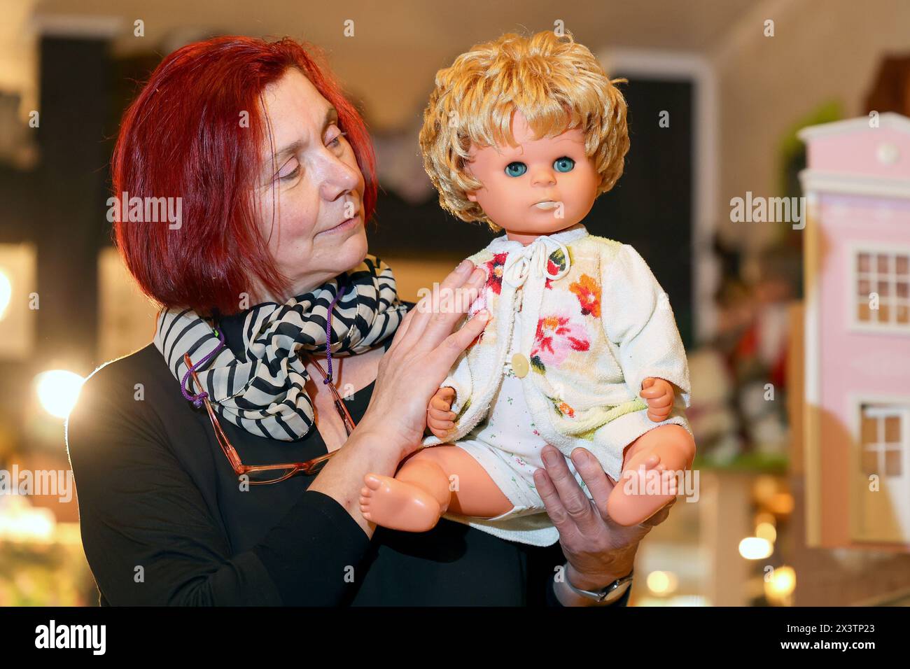 Nienhagen, Germany. 26th Apr, 2024. Simone Schuldt from the Nienhagen Doll and Teddy Museum ...