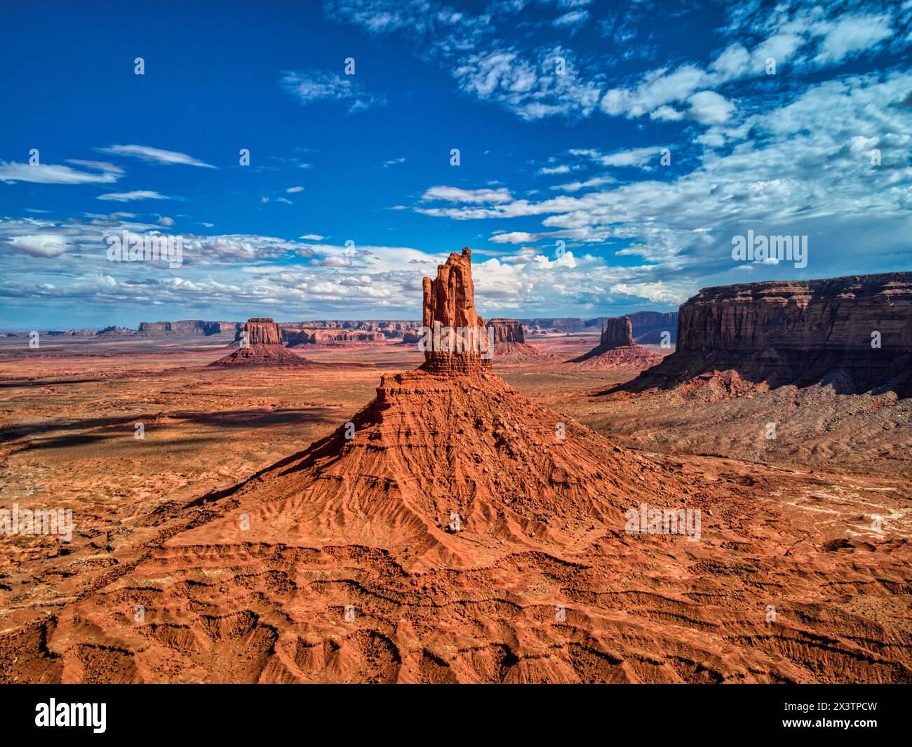 The image shows a vast desert landscape in Monument Valley, near the ...