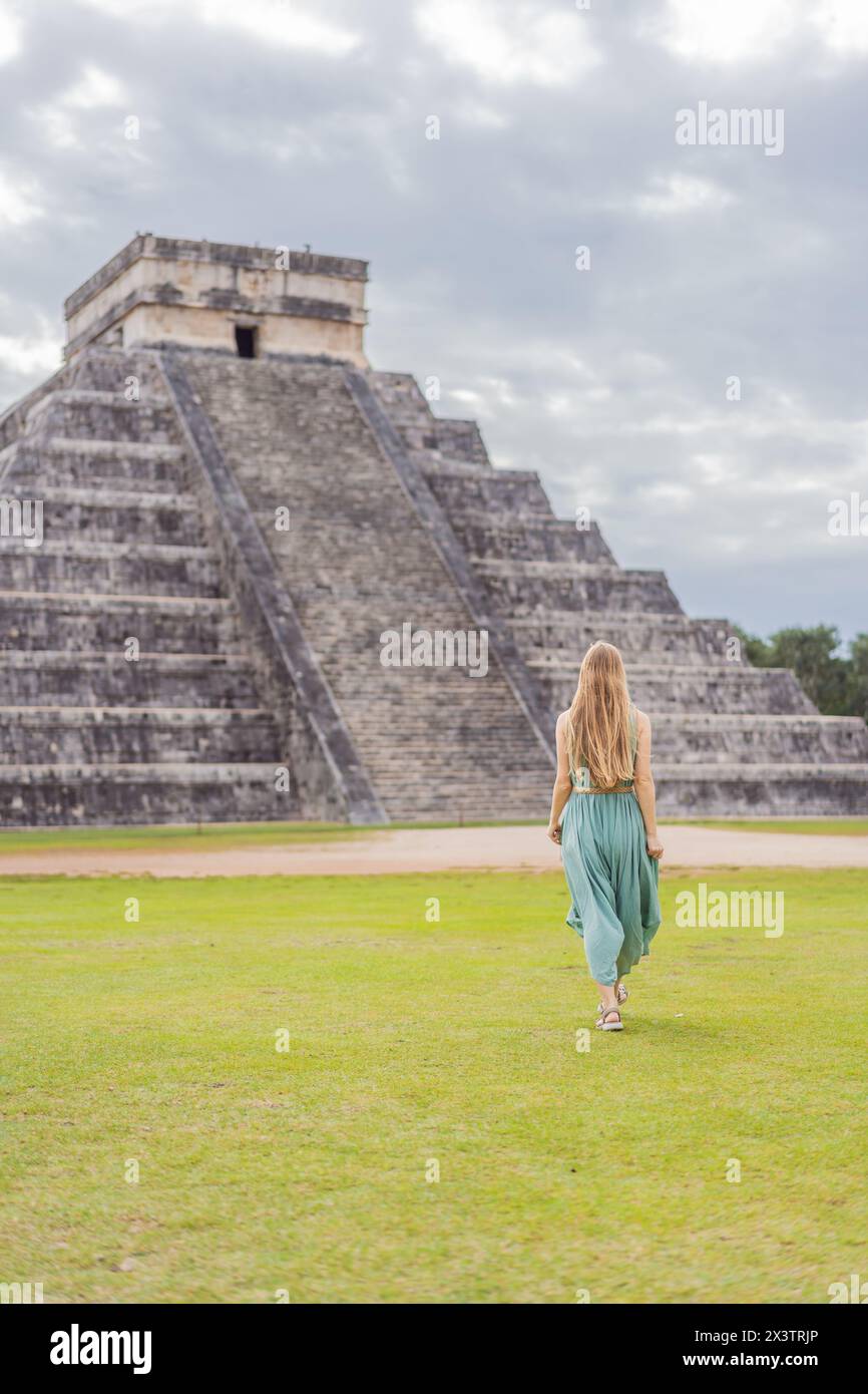 Beautiful tourist woman observing the old pyramid and temple of the ...