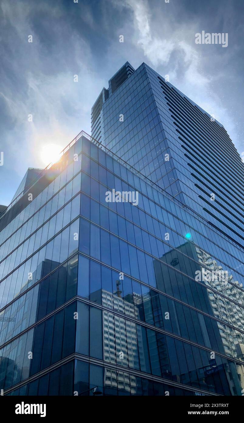 The image captures the imposing architecture of a modern skyscraper ...