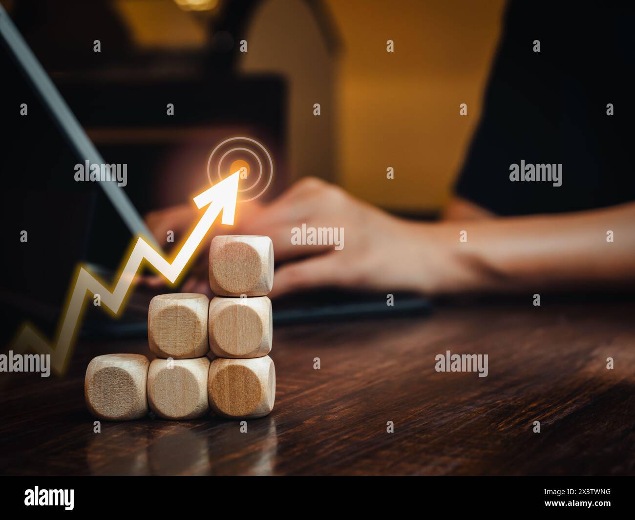 Glowing arrow hit on target icon on wooden cube blocks as graph steps ...