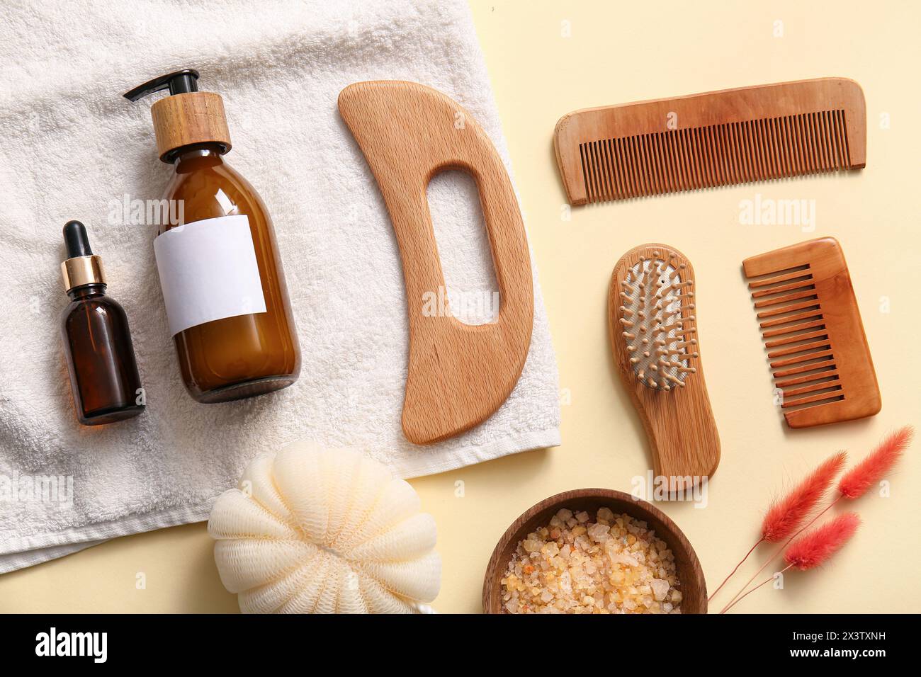 Beautiful spa composition with guasha body scraper on beige background ...